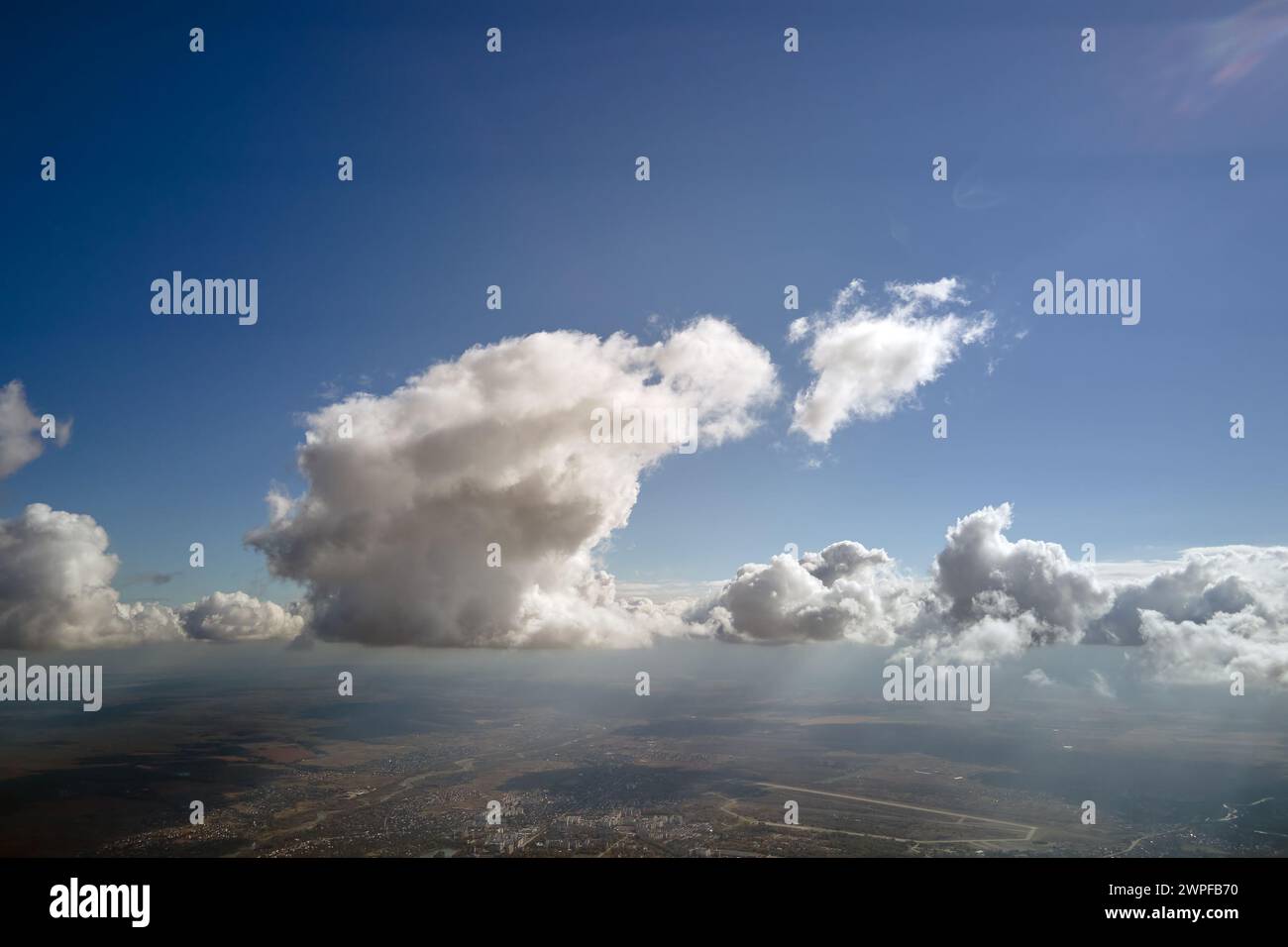 Aerial view from airplane window at high altitude of earth covered with ...
