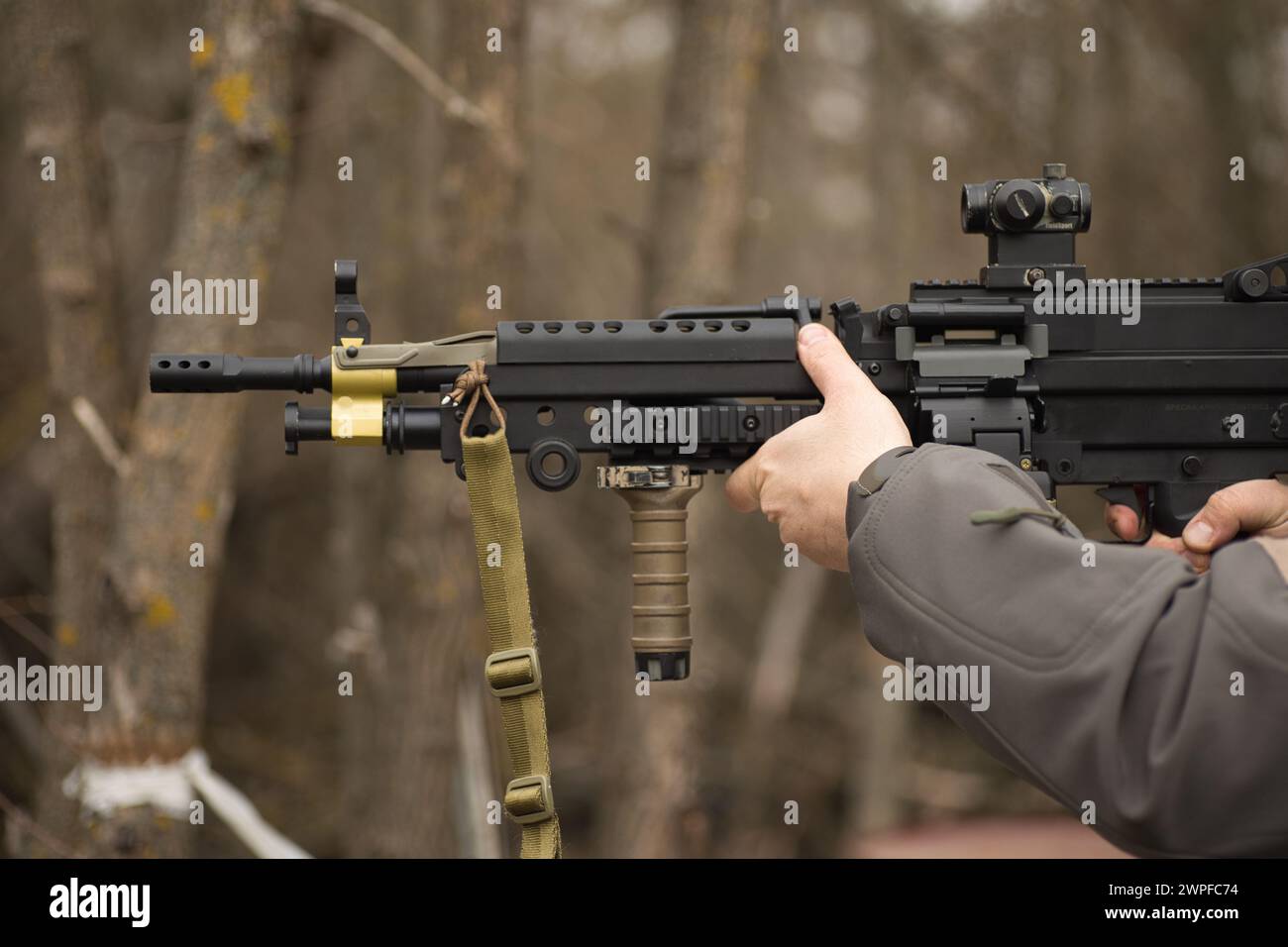 airsoft replica weapon, machine gun on a natural background Stock Photo ...