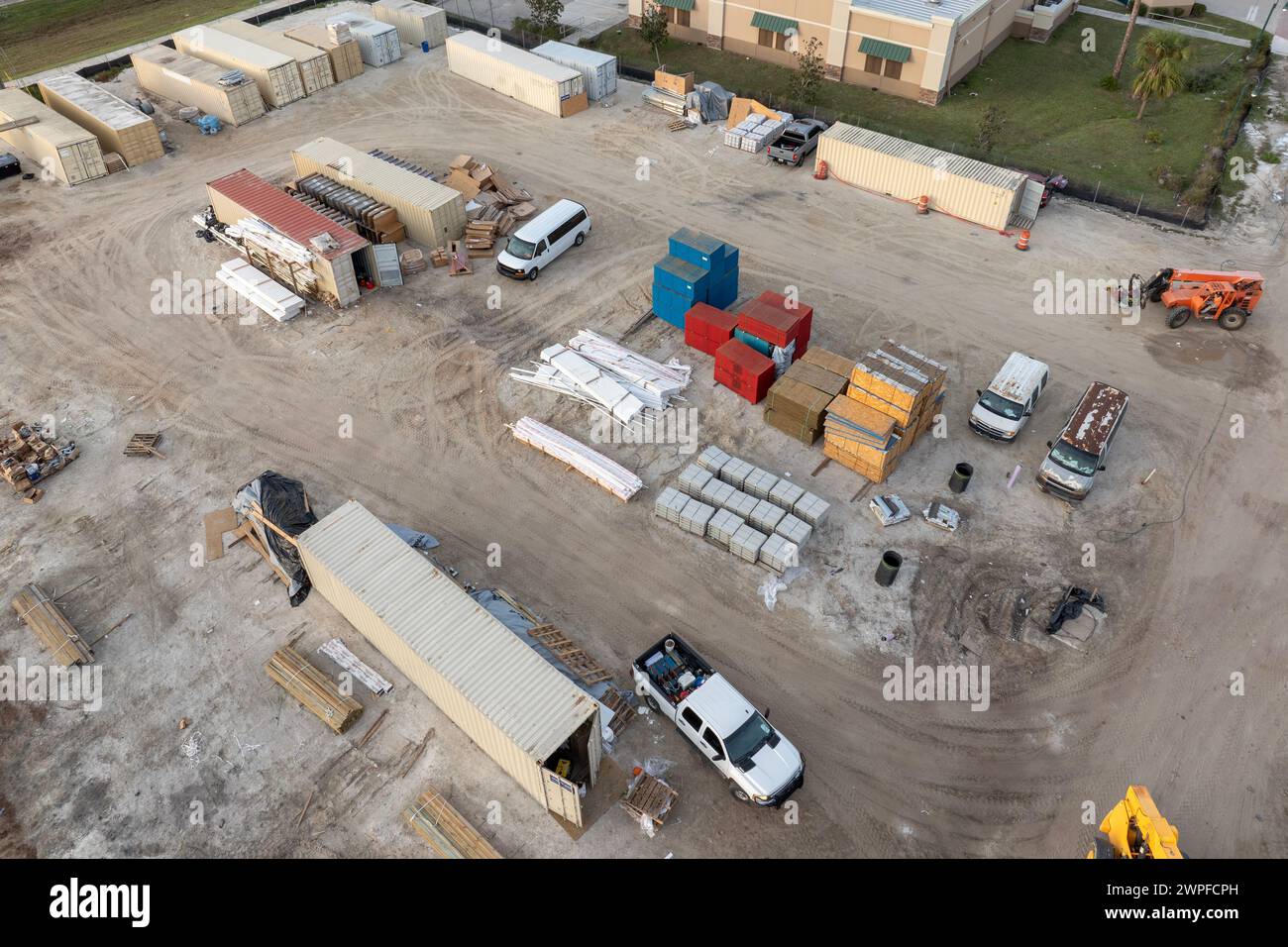 Construction site with building equipment on prepared ground in ...