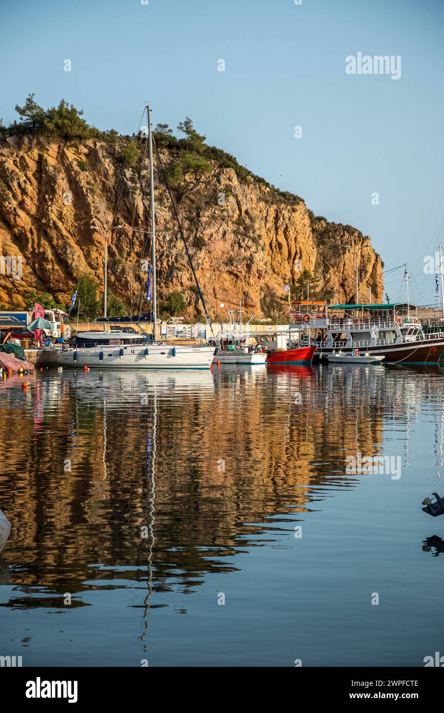 Small boats and yachts docked on the marina park with oceanfront view ...