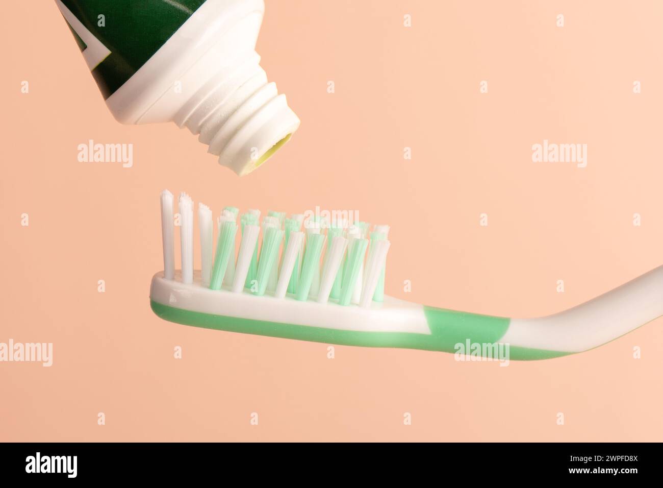 Toothbrush and tube of toothpaste before squeezing the paste onto the ...
