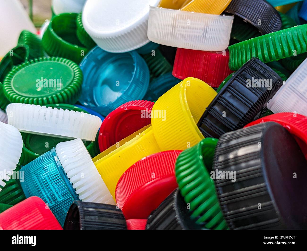 Lots of different plastic bottle caps. Garbage sorting Stock Photo - Alamy