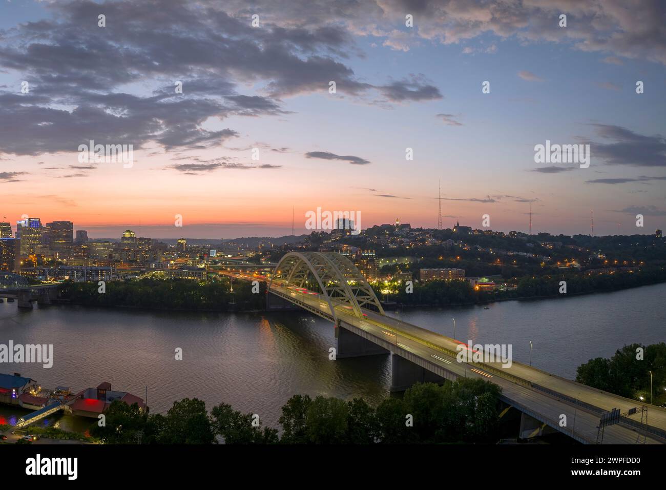 Highway traffic with driving cars on bridge in downtown district of ...