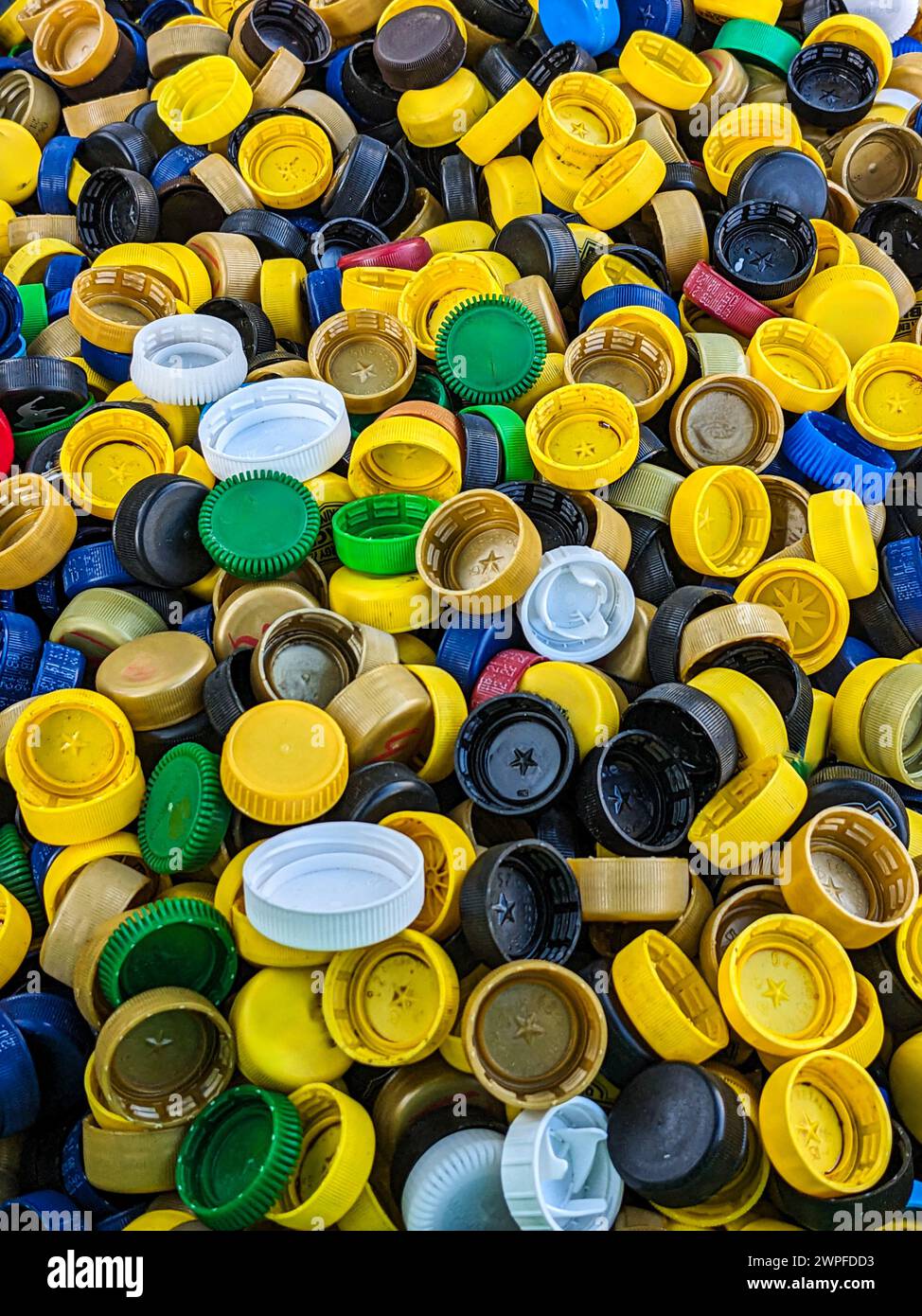Lots of different plastic bottle caps. Garbage sorting Stock Photo - Alamy