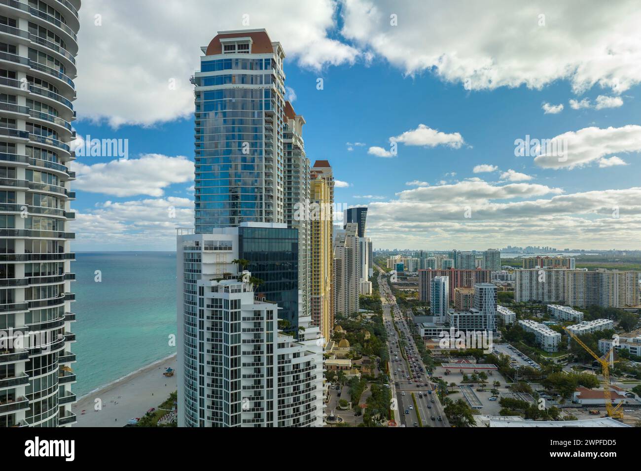 Sunny Isles Beach city with heavy urban traffic and expensive highrise ...