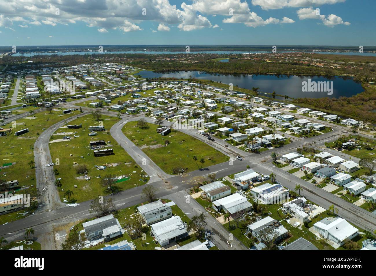 Hurricane damage to recreational vehicle camper vans and houses in ...