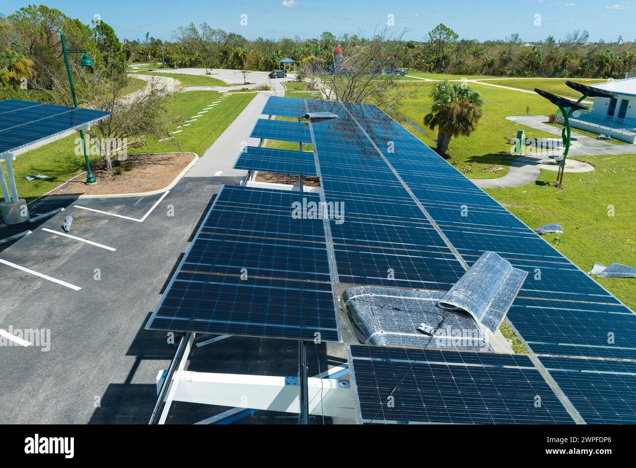 Hurricane wind damage to solar panels installed as shade roof over ...