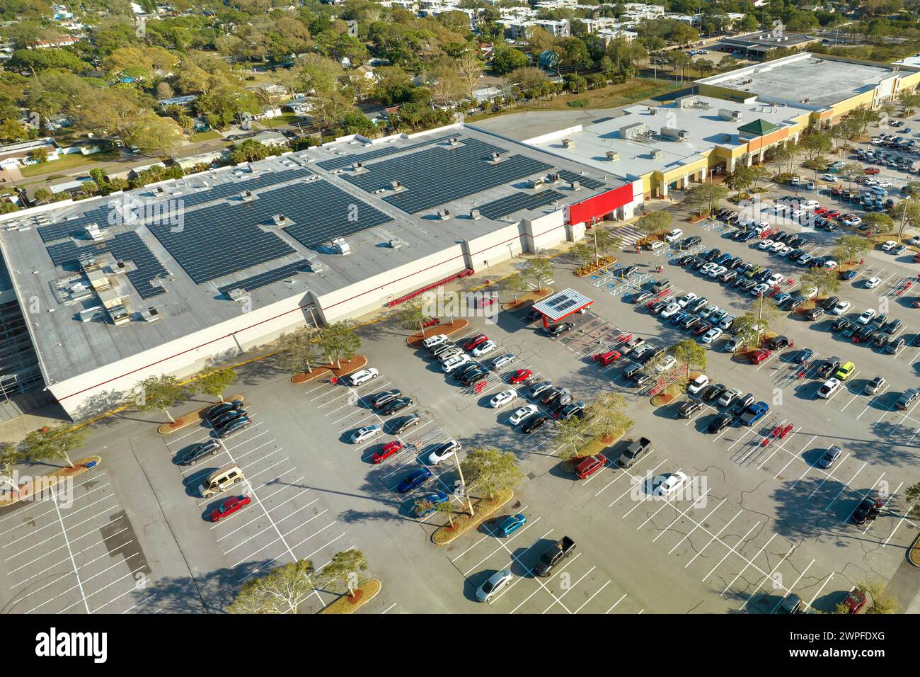 Many parked cars on store parking lot with lines and markings for ...