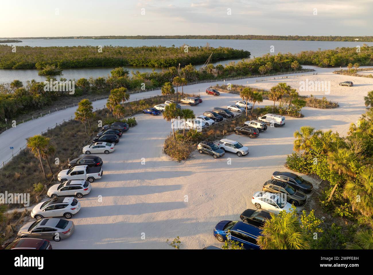 Parking lot at Florida Blind Pass beach on Manasota Key, USA. Vehicle ...
