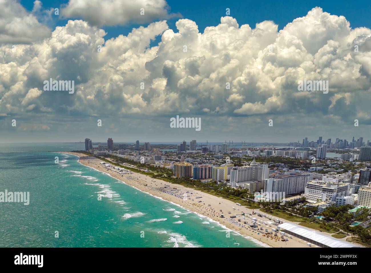 South Beach sandy surface with tourists relaxing on hot Florida sun ...