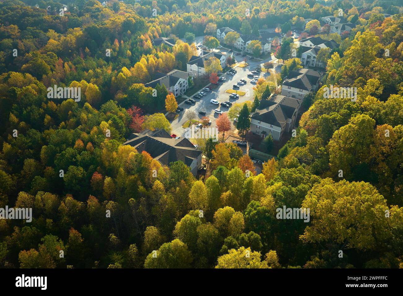 View from above of apartment residential condos between yellow fall ...