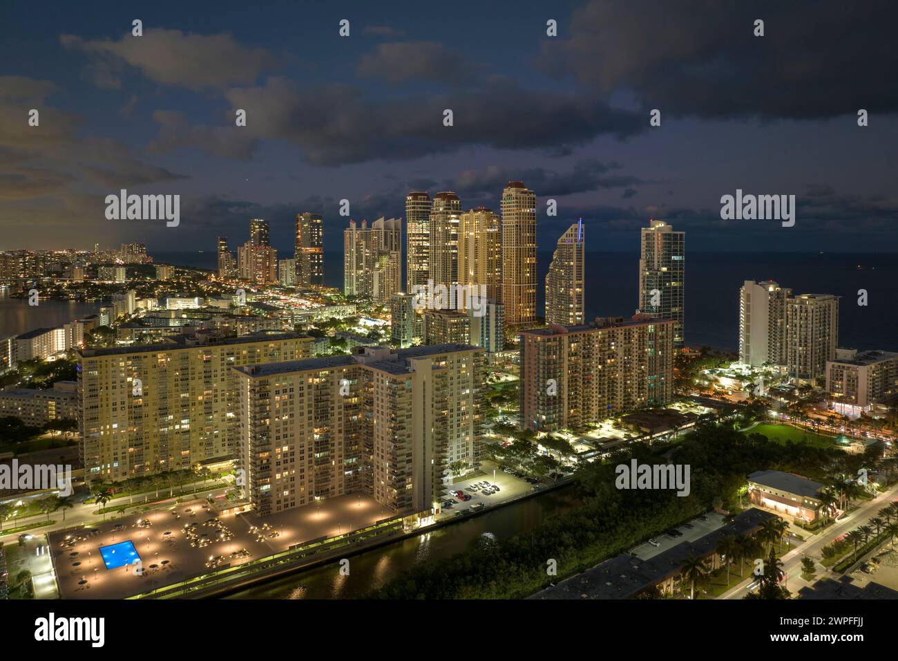 View from above of brightly illuminated high skyscraper buildings in ...