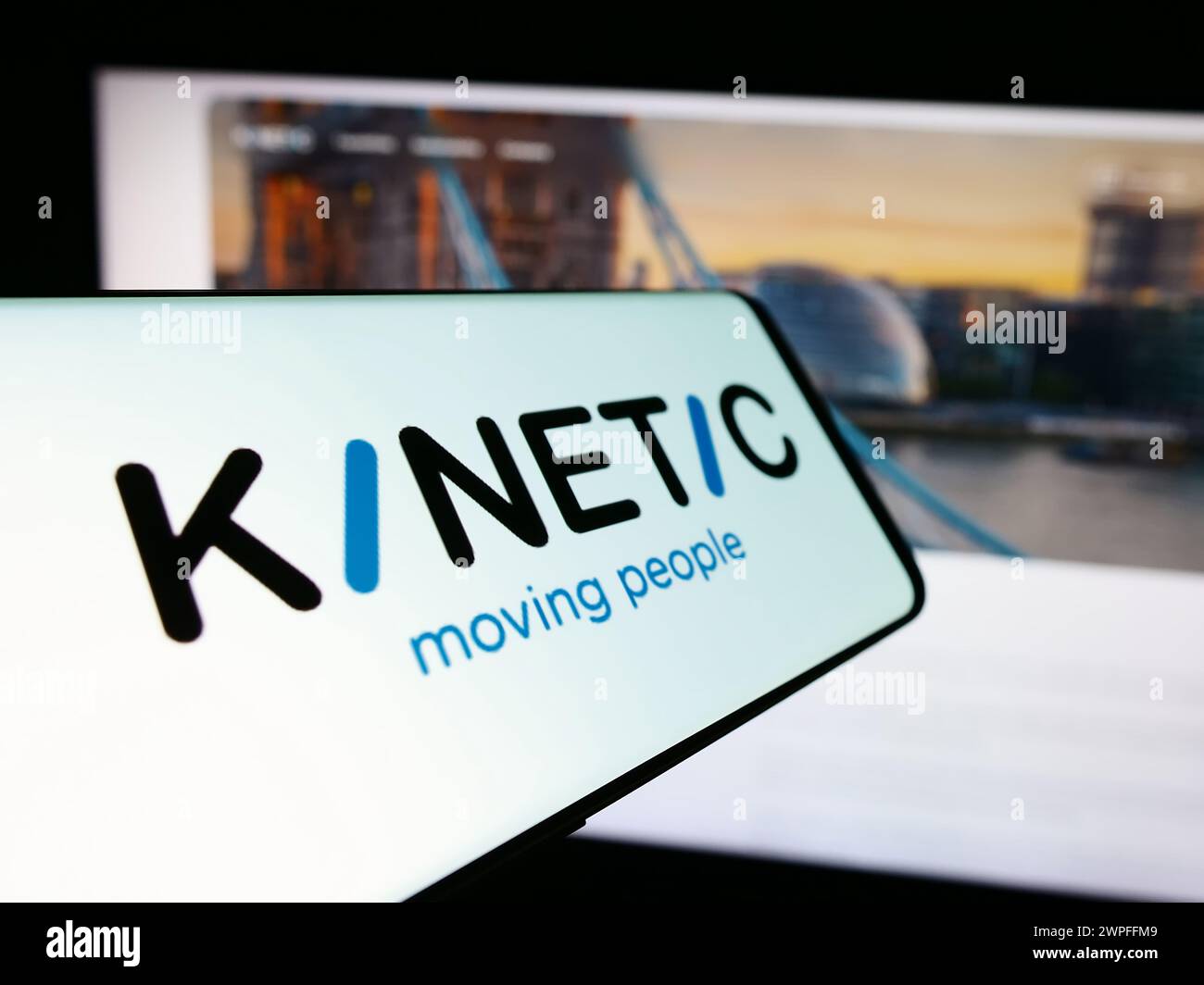 Mobile phone with logo of Australian mobility company Kinetic Group in front of business website ...