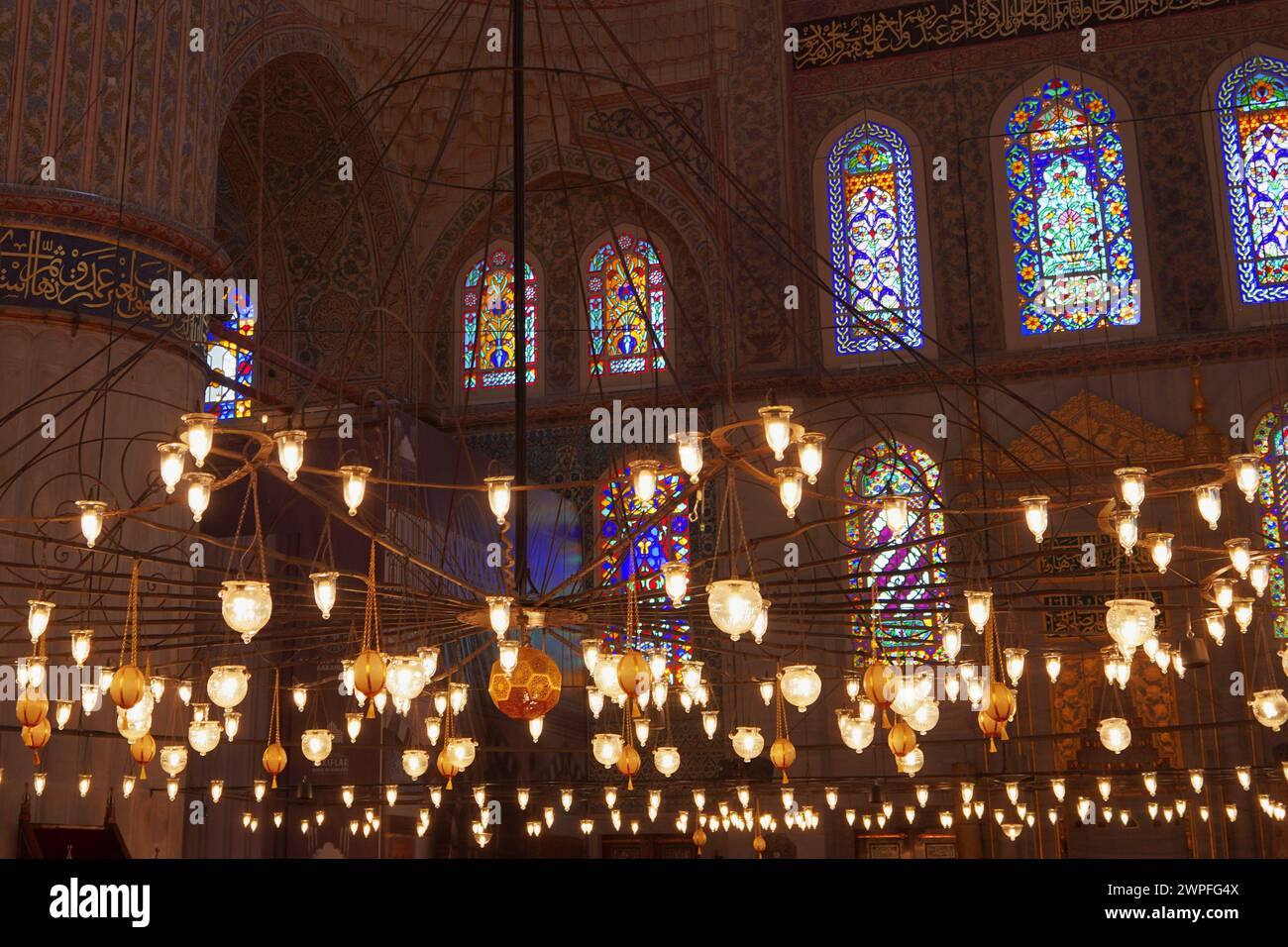 The beautiful and intricate lighting inside the Blue Mosque, Sultanamet ...