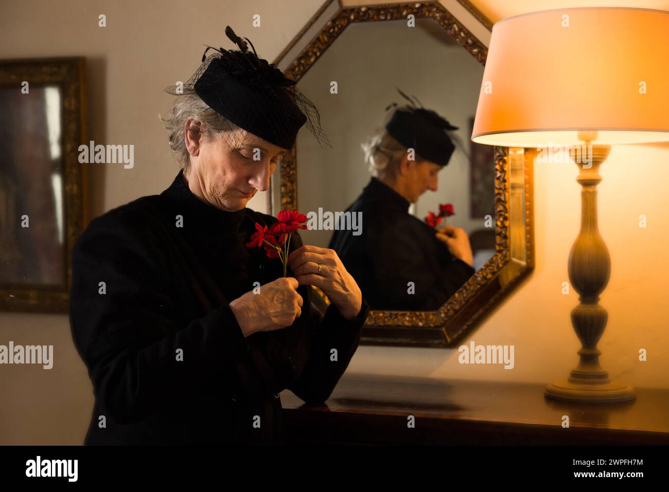 Portrait of a widow dressed in authentic Victorian dress and matching ...