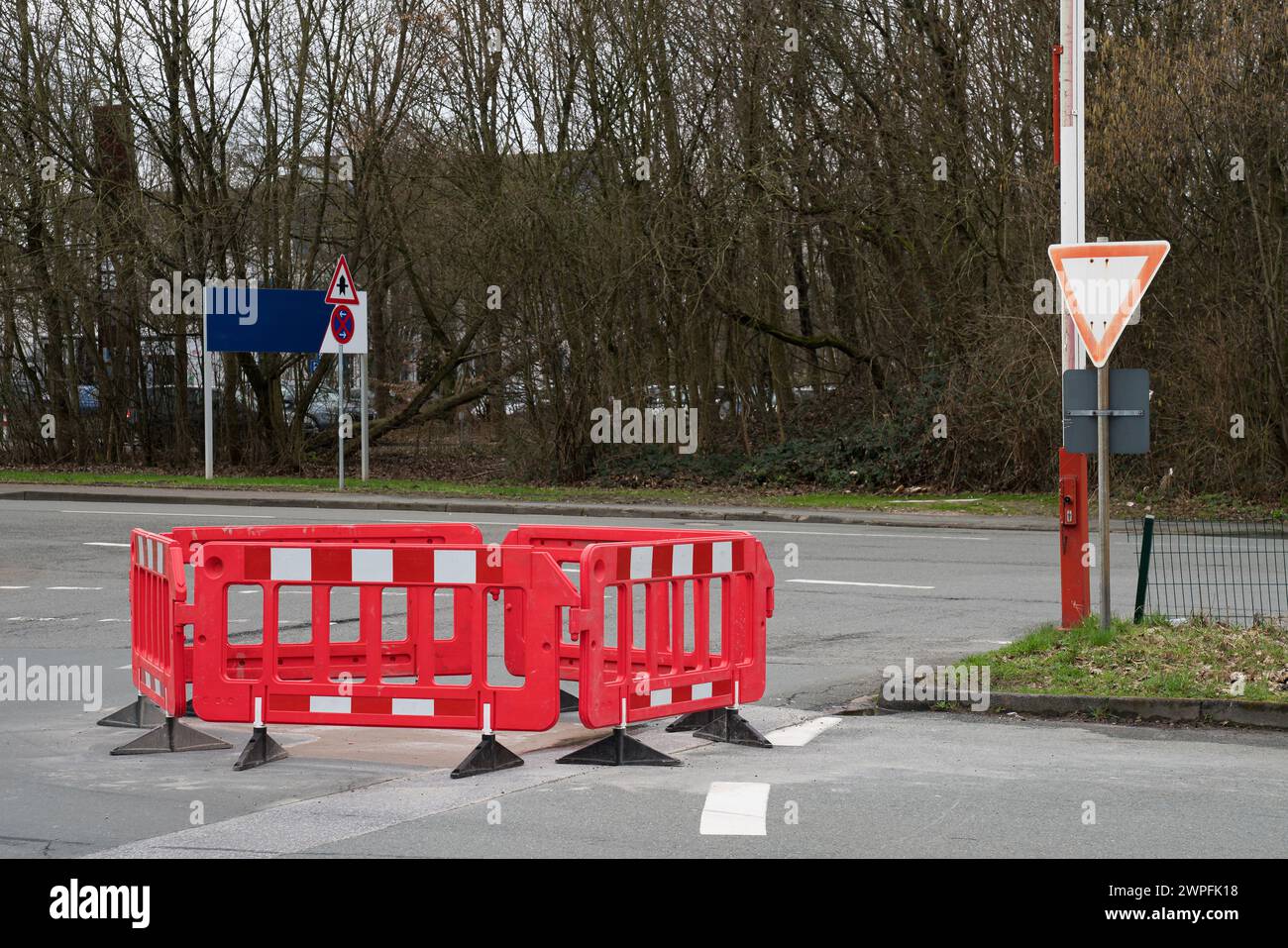 Red and white plastic mobile shields fence off the site where the ...