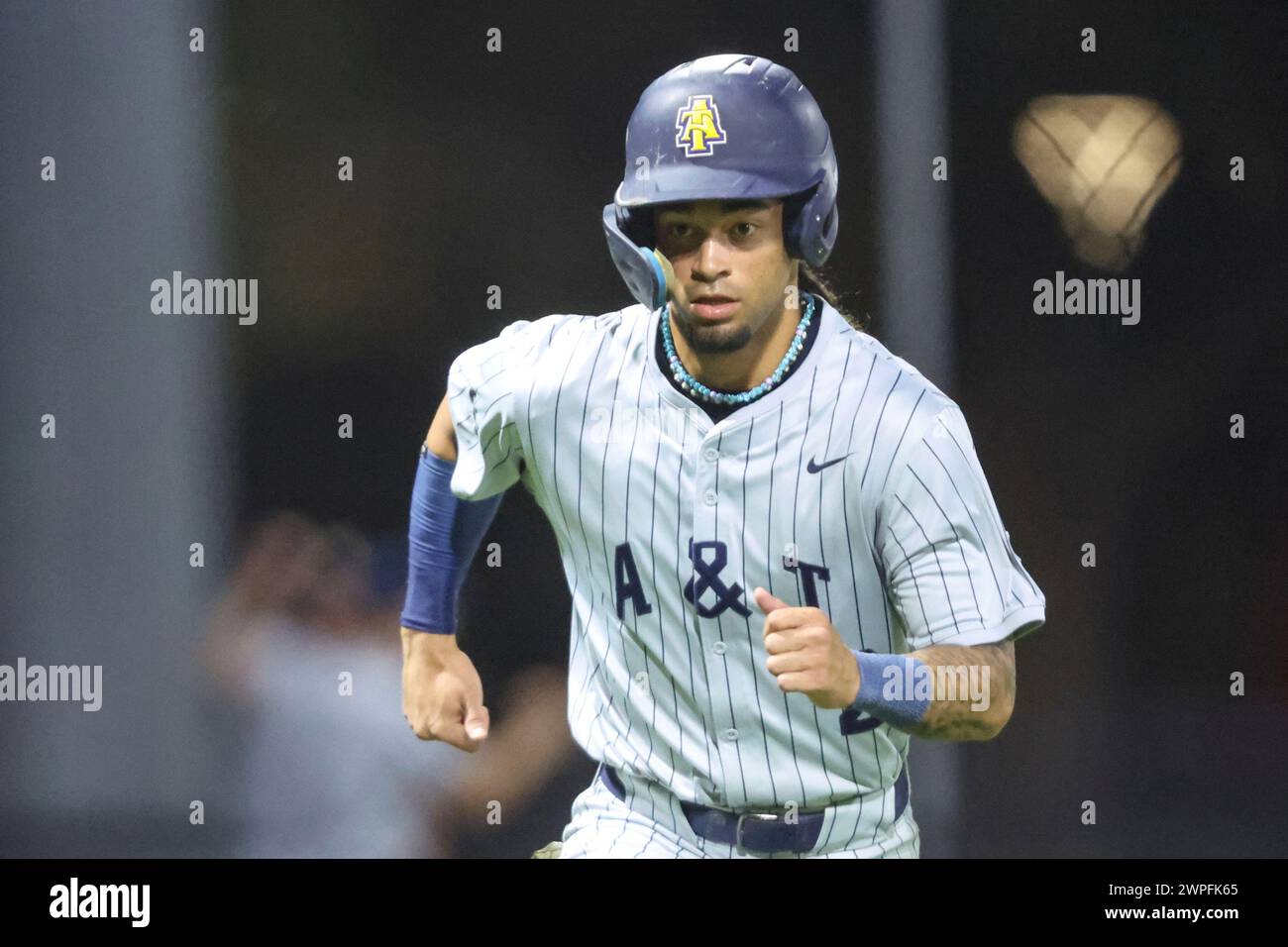 North Carolina A&T outfielder Camden Jackson (2) runs to home plate ...