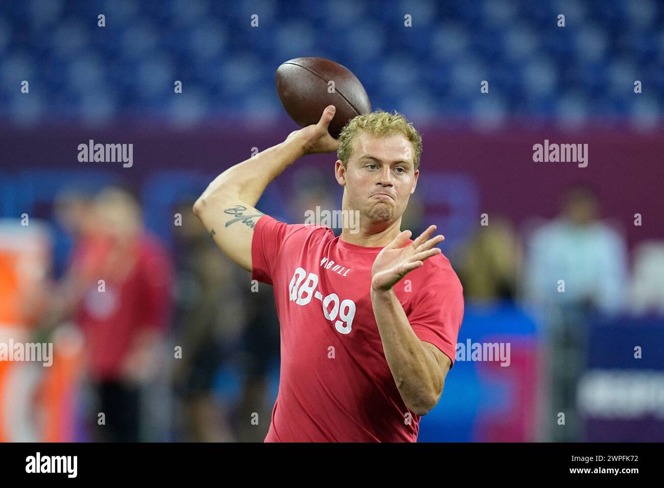 Tulane quarterback Mike Pratt runs a drill at the NFL football scouting ...