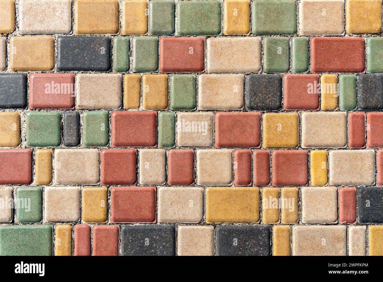 Colorful pavement on sunny day in public park. Colorful paving stones ...