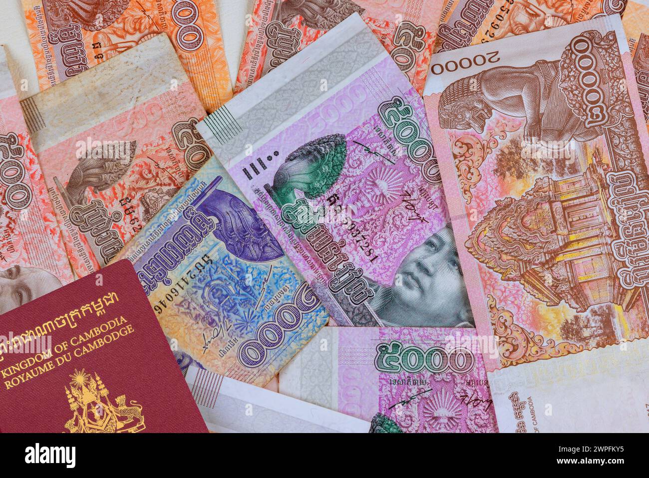 Passport Kingdom of Cambodia over Cambodian national currency ...