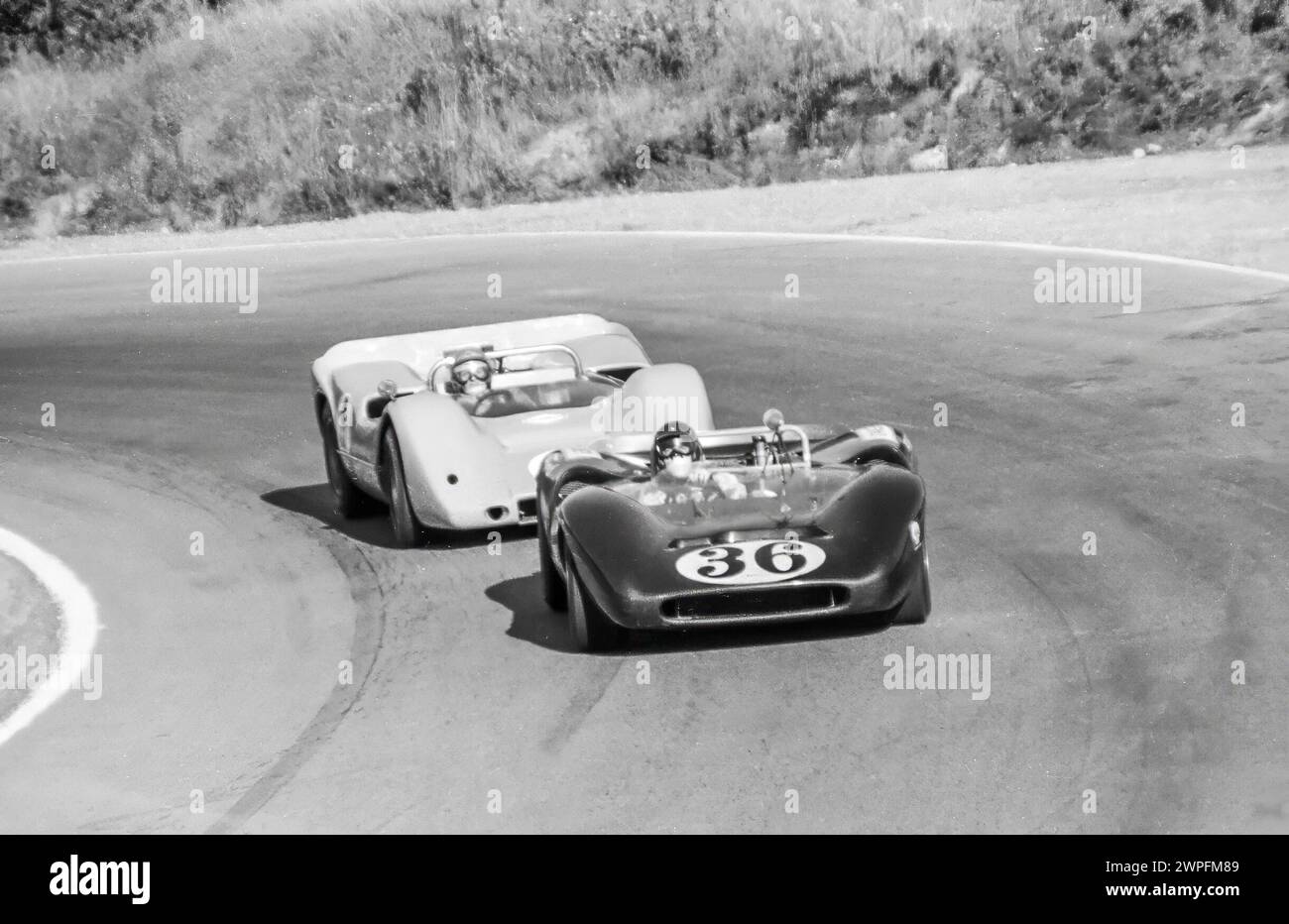 Dan Gurney in a Lola T70 Mk 3B Ford ahead of Bruce McLaren in a McLaren ...