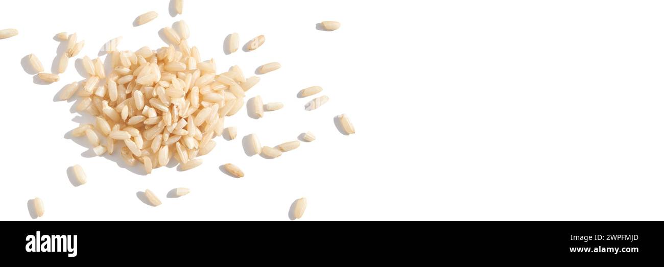 A top view of raw brown and white rice, forming a heap. The integral ...