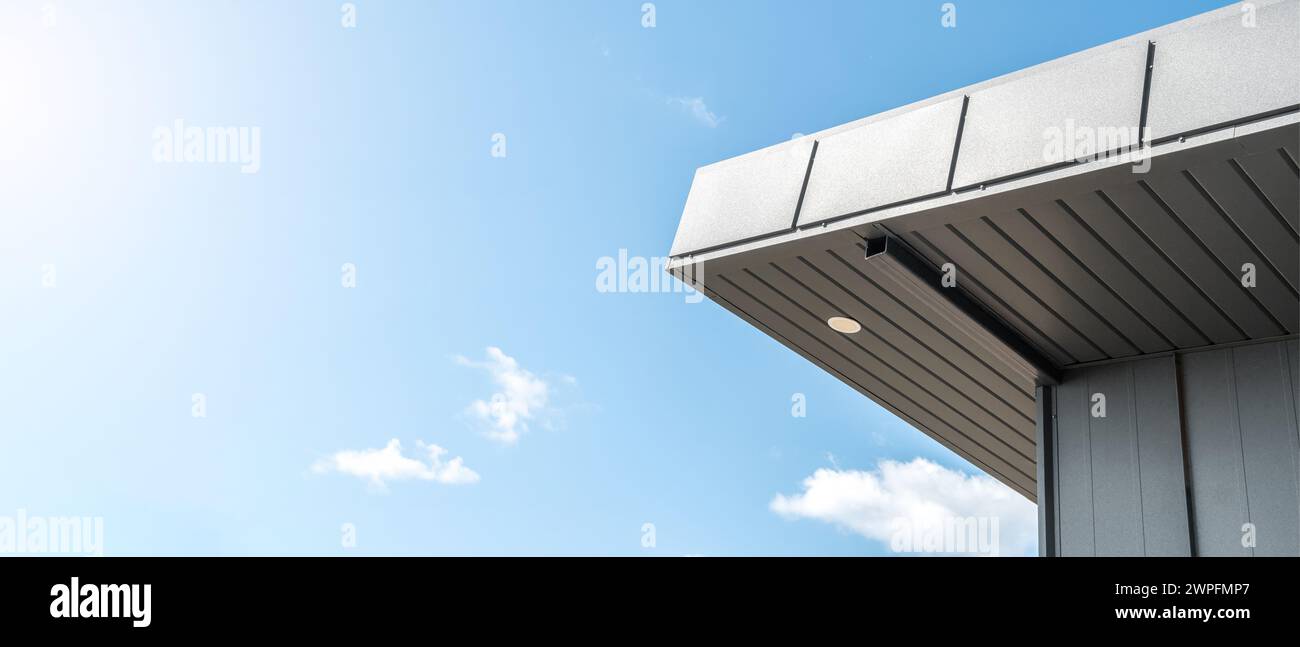 Modern guest house with standing seam facade and large flat roof ...