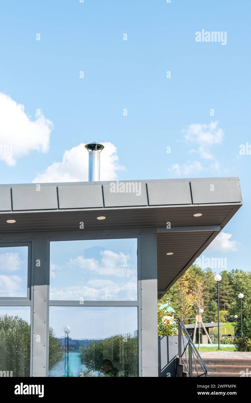 Stylish guest house with panoramic window at resort on summer day ...