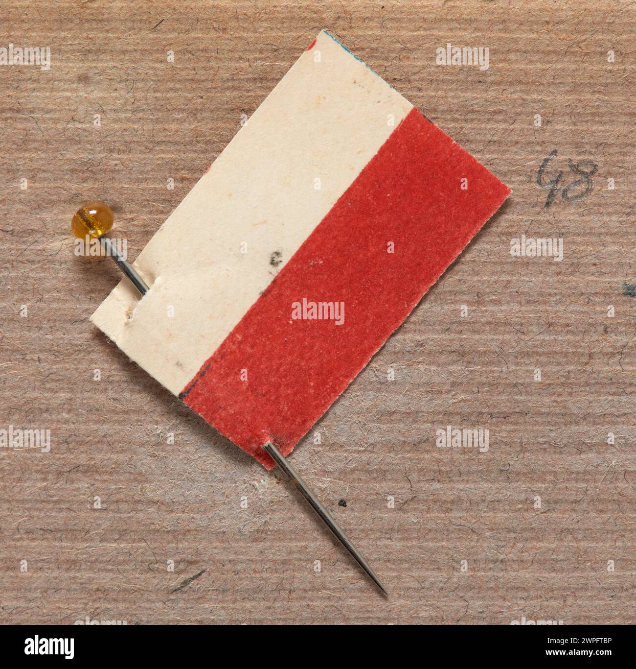 This circular print from 1914–1920 depicts the Polish flag, reflecting ...