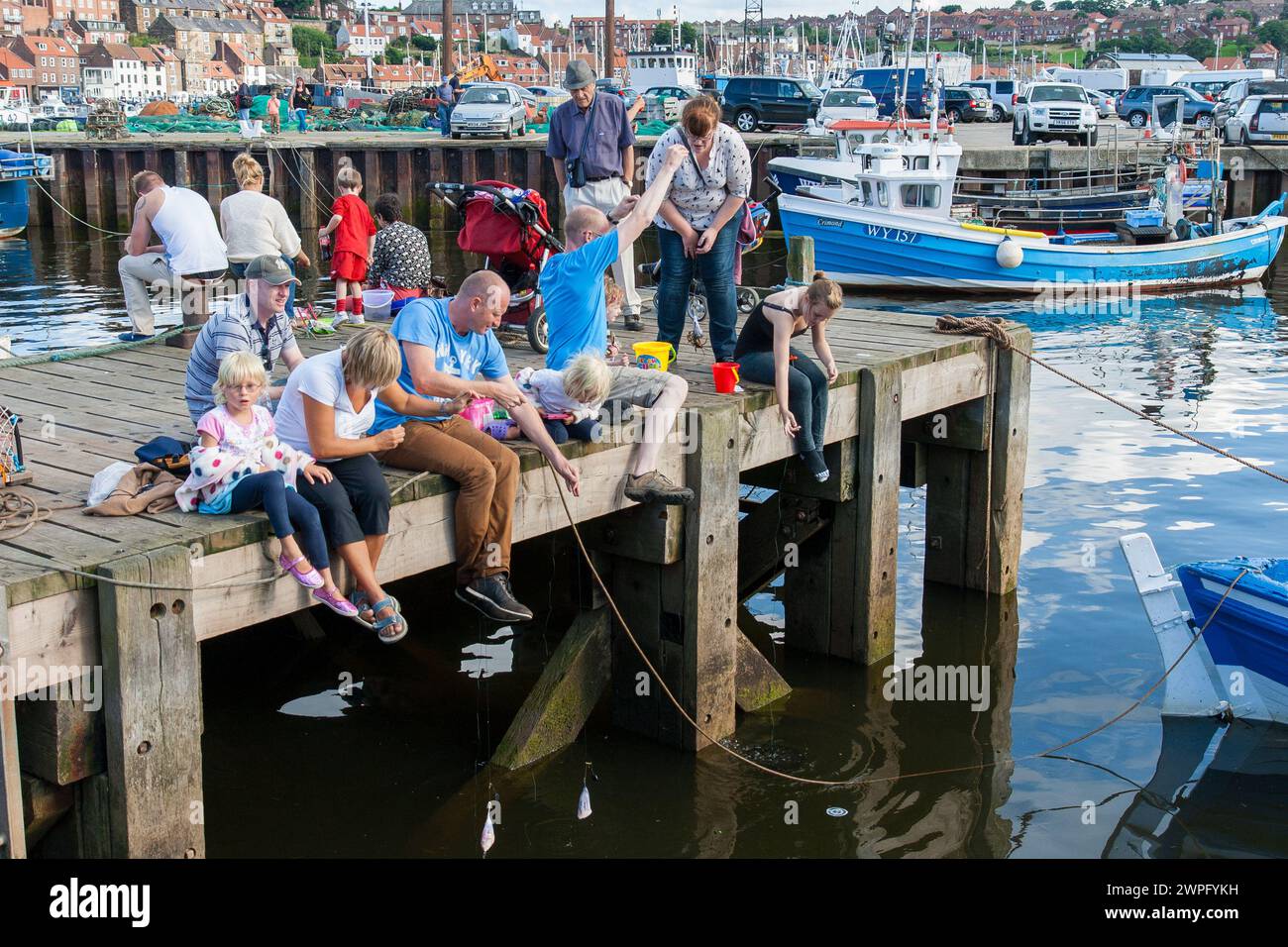 Fishing for crabs at Whitby Stock Photo - Alamy