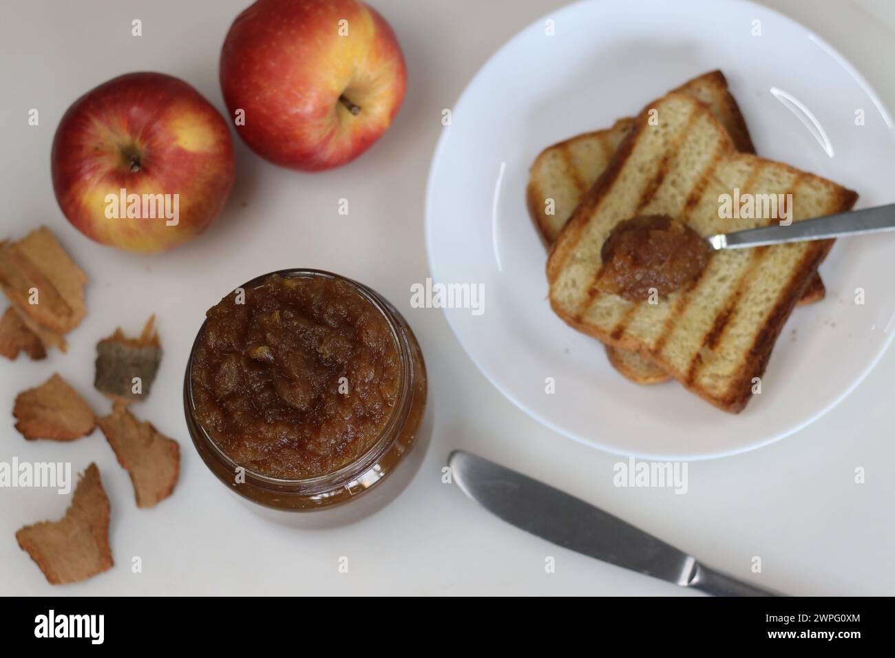 Homemade apple jam spread on bread toast. Fresh fruit preserve, autumn ...