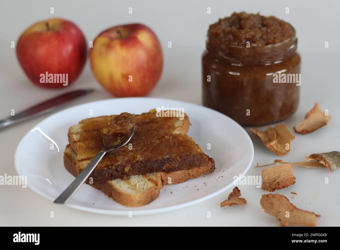 Homemade apple jam spread on bread toast. Fresh fruit preserve, autumn ...