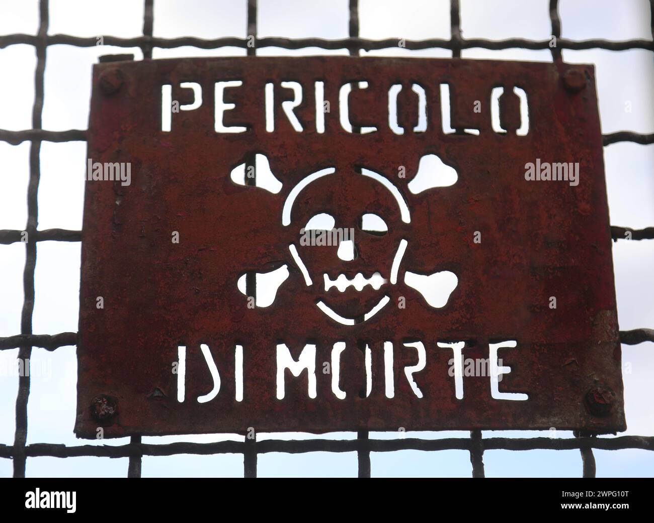 iron sign with the writing in Italian Pericolo di Morte which means ...