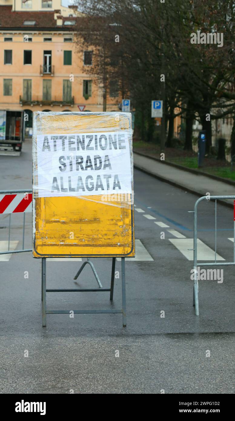 warning sign with big text ATTENZIONE STRADA ALLAGATA in italian ...