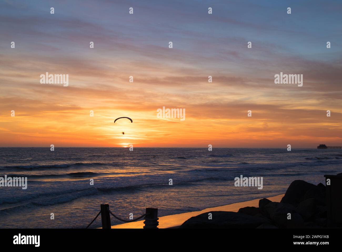 Beautiful and peaceful solo parasailer paramotoring over the ocean at ...