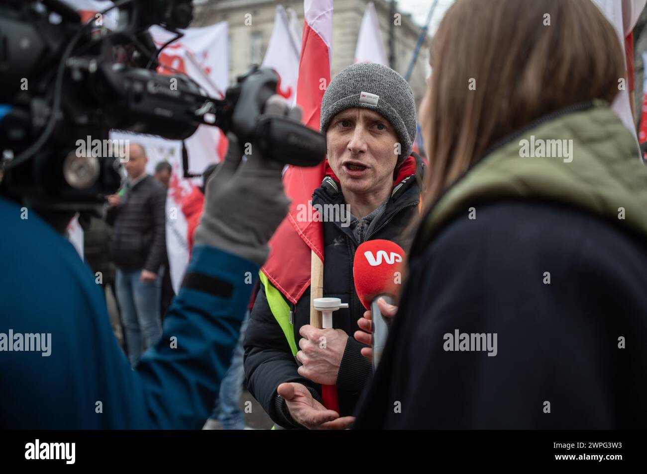 A protester speaks to media during the demonstration. Farmers gathered ...