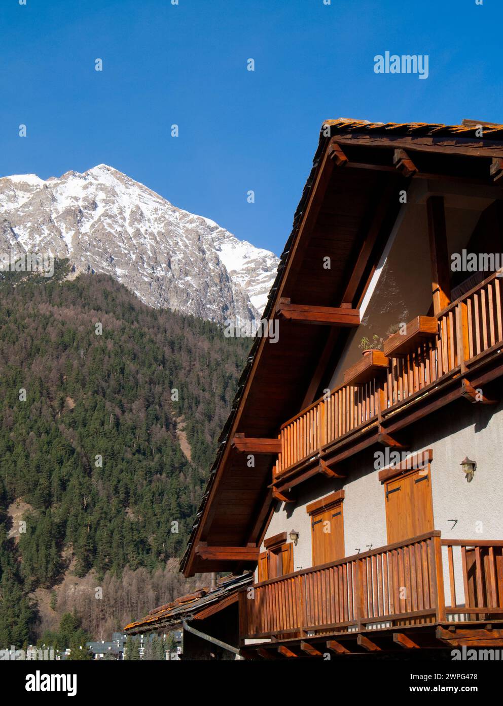 Complementary shapes and colours of mountain, sky and roof, Cesana ...
