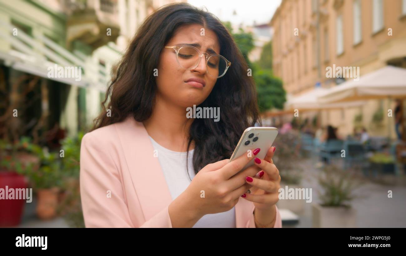 Upset frustrated Indian Arabian ethnic woman girl feeling annoyed using ...