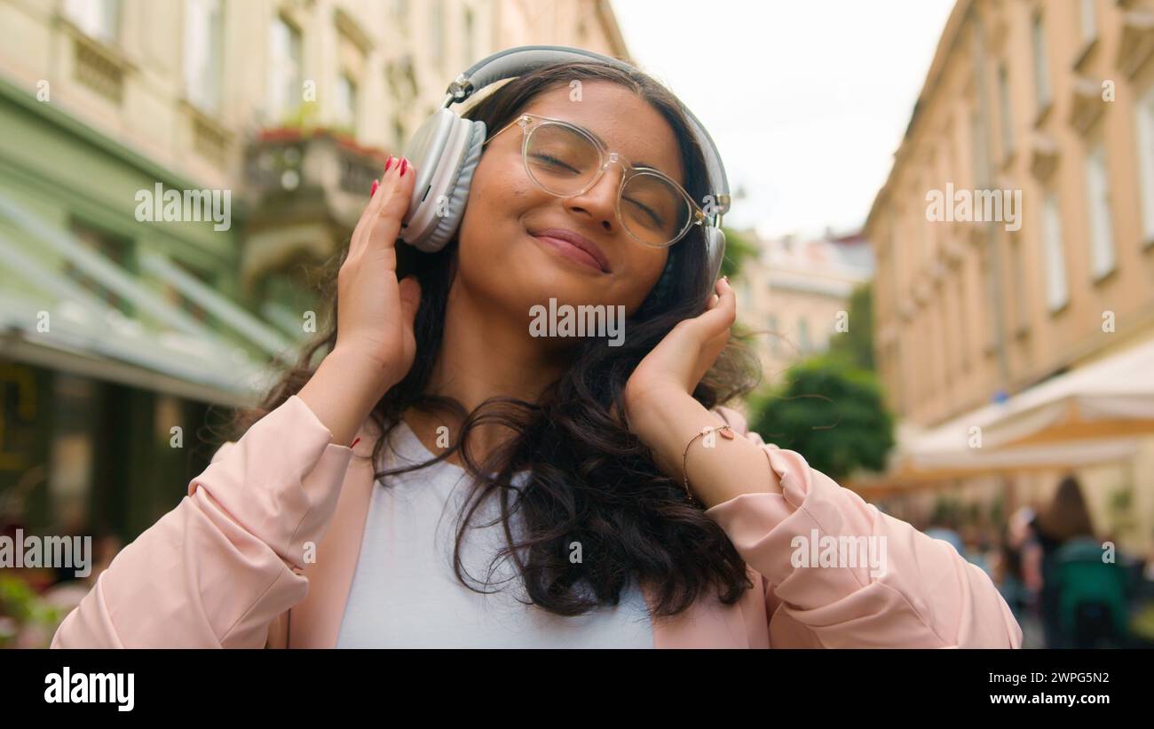 Joyful relaxed Indian Arabian ethnic teen gen z woman student lady ...