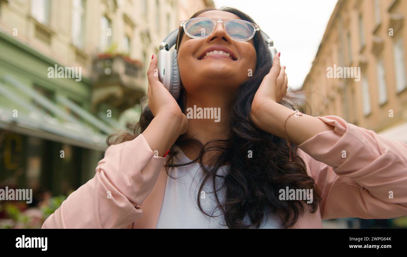 Joyful relaxed Indian Arabian ethnic teen gen z woman student lady ...