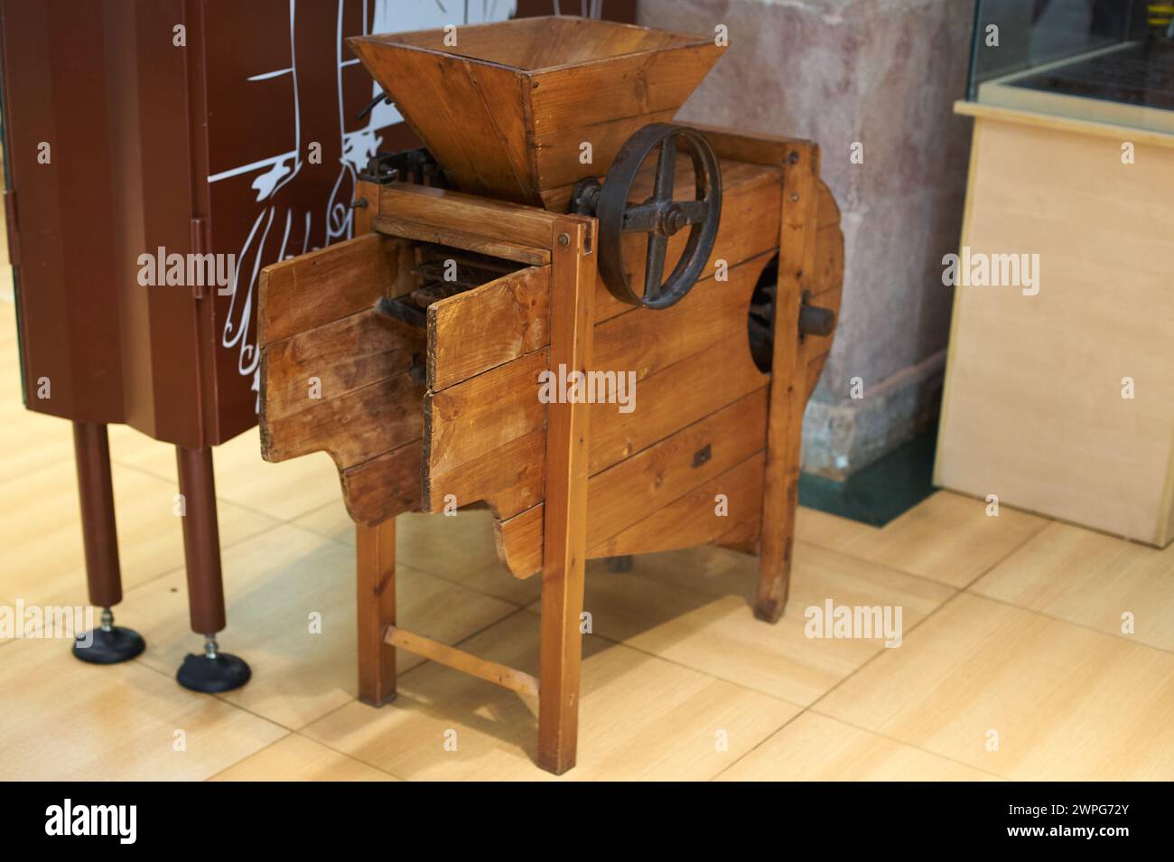 Close-up of an antique machine used in the chocolate making process ...