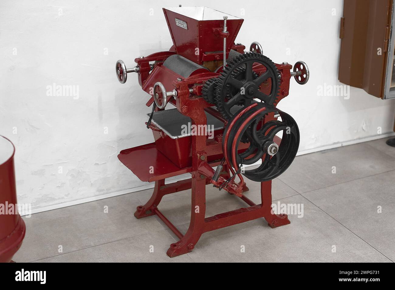 Close-up of an antique machine used in the chocolate making process ...