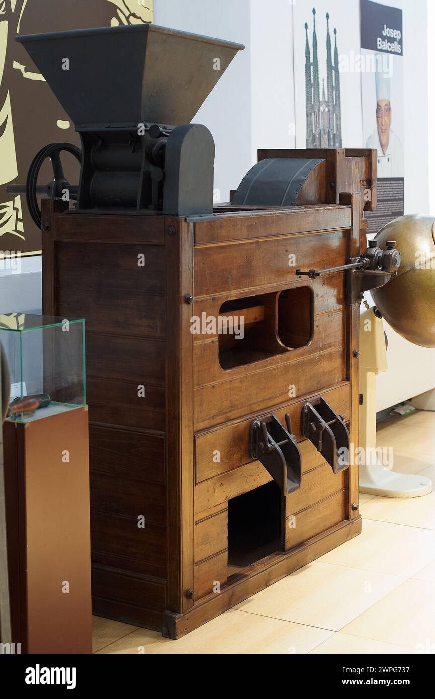 Close-up of an antique machine used in the chocolate making process ...