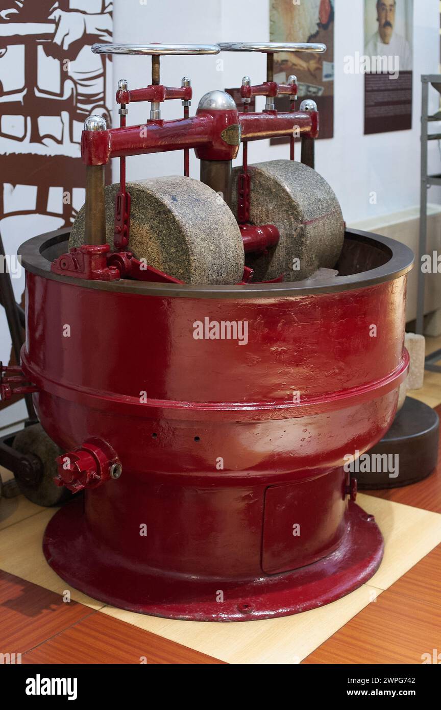 Close-up of an antique machine used in the chocolate making process ...