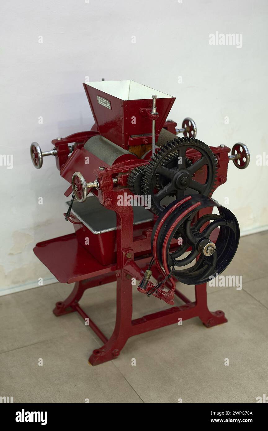 Close-up of an antique machine used in the chocolate making process ...