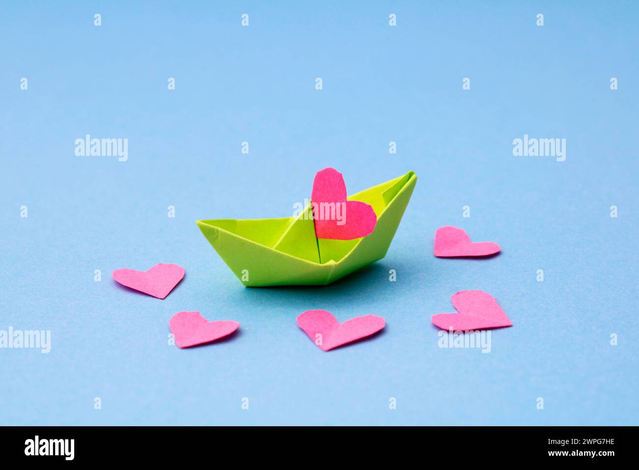 Paper boat charged with hearts, I love sailing Stock Photo - Alamy