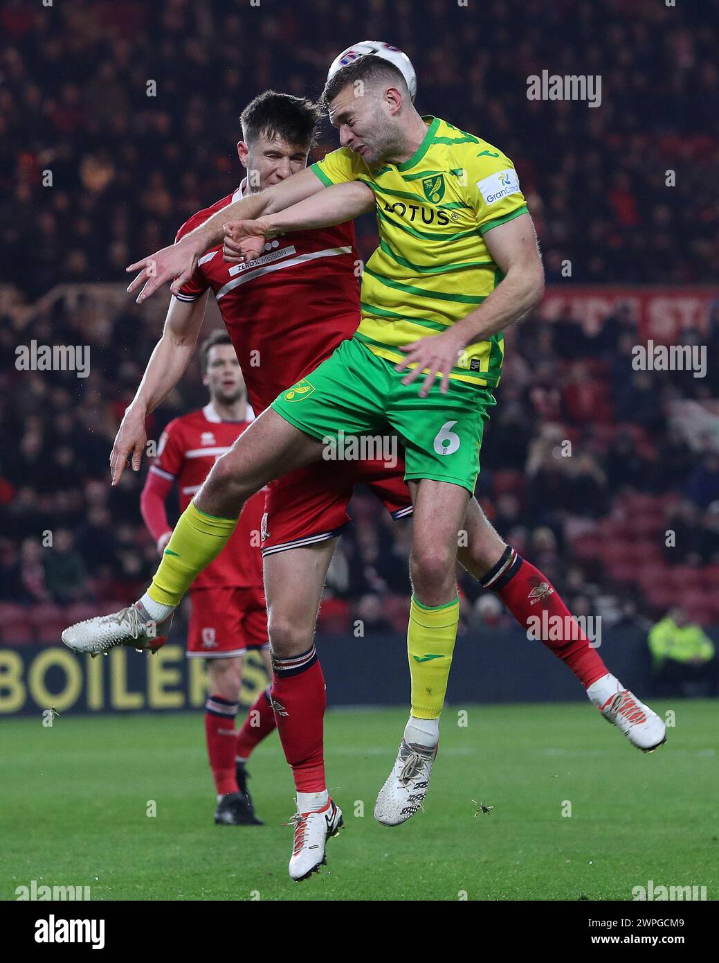 Ben Gibson of Norwich City challenges for a header with Middlesbrough's ...