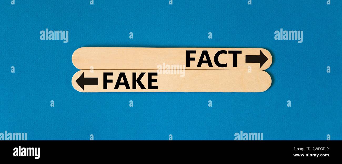 Fact or fake symbol. Concept word Fake and Fact on beautiful wooden ...