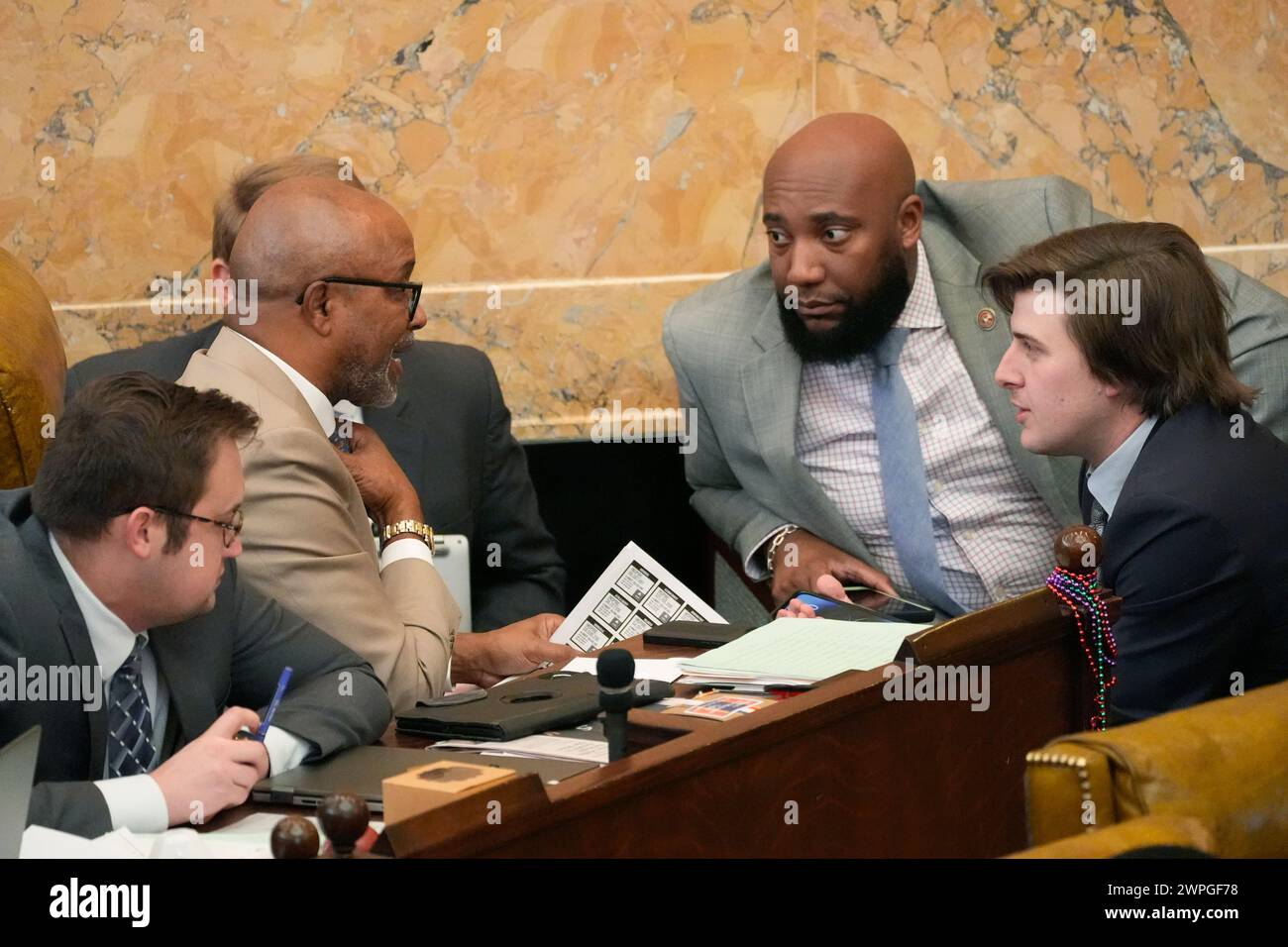 Mississippi state Rep. Robert Johnson, D-Natchez, second from left, confers with House Education ...