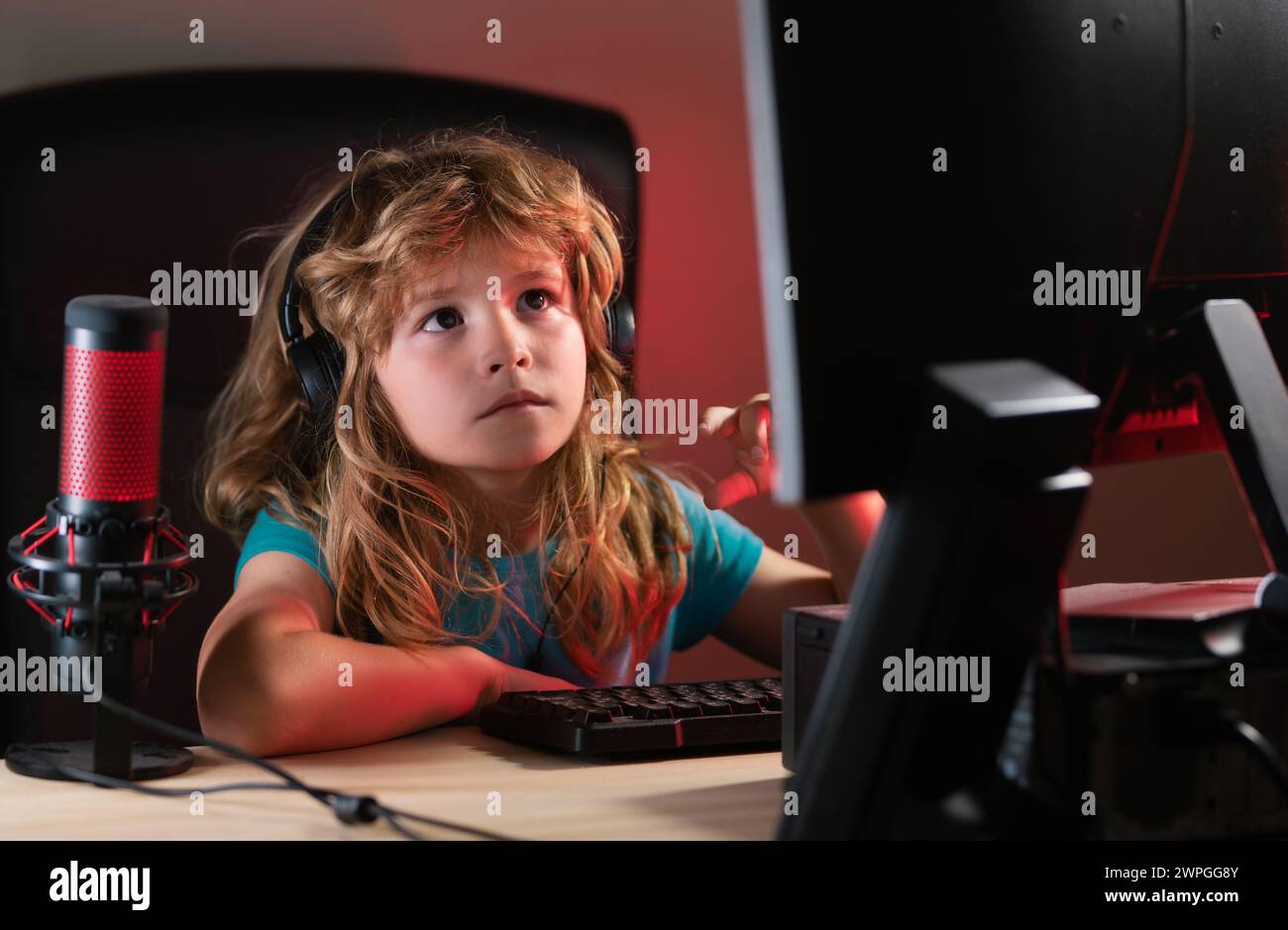 Cute preschool child watching video lesson by laptop Stock Photo - Alamy
